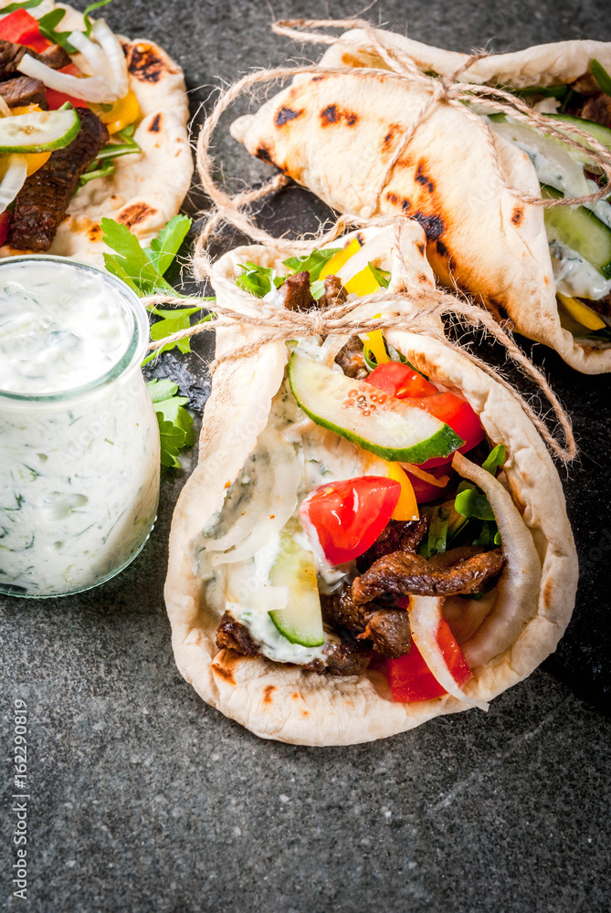 Healthy snack, lunch. Traditional Greek wrapped sandwich gyros ...