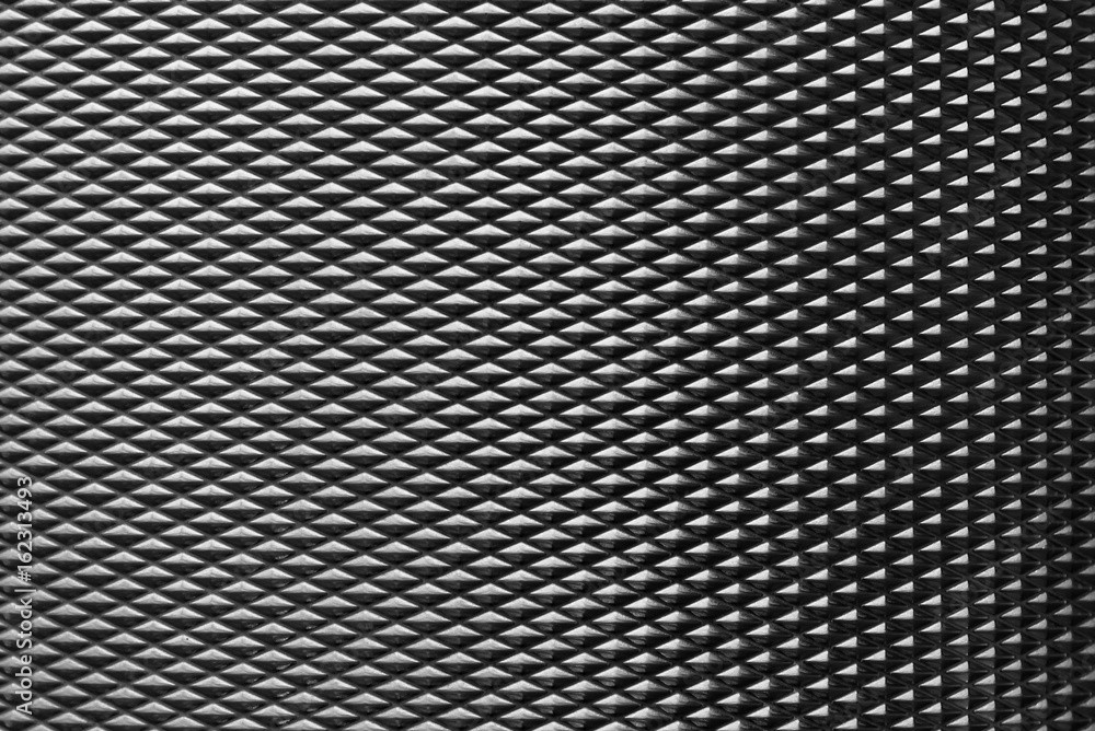 The diamond shape metal brush texture background in the dark scene ...