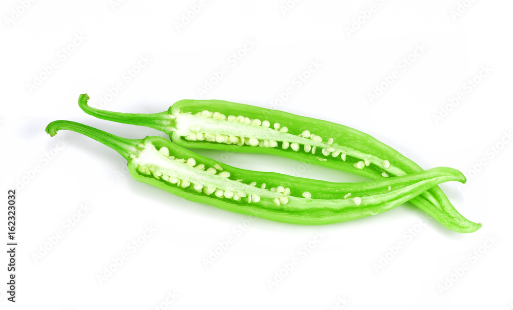 chilli slice, Green peppers and cut in half on white background Stock ...