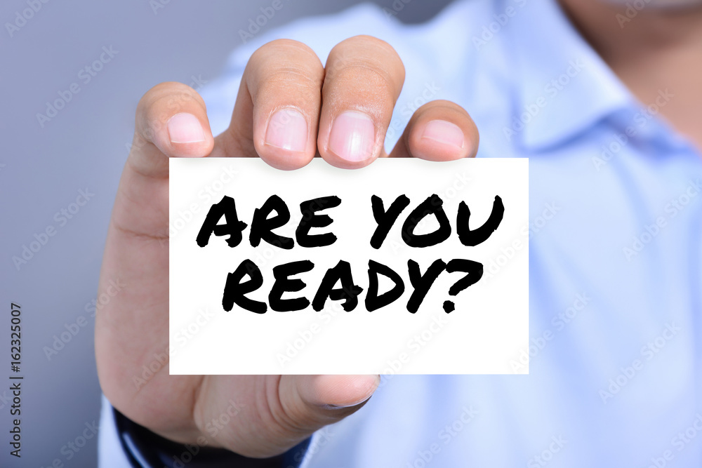 ARE YOU READY? message on the card shown by a man Stock Photo | Adobe Stock
