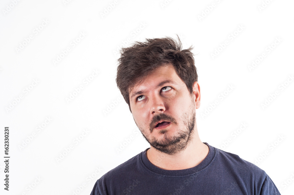 Portrait of 30 years old man with boring and misunderstanding face and ...