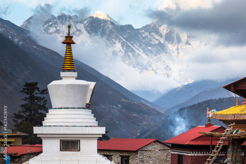 Buddhist stupa of Tengboche Monastery and the top of Everest in the ...