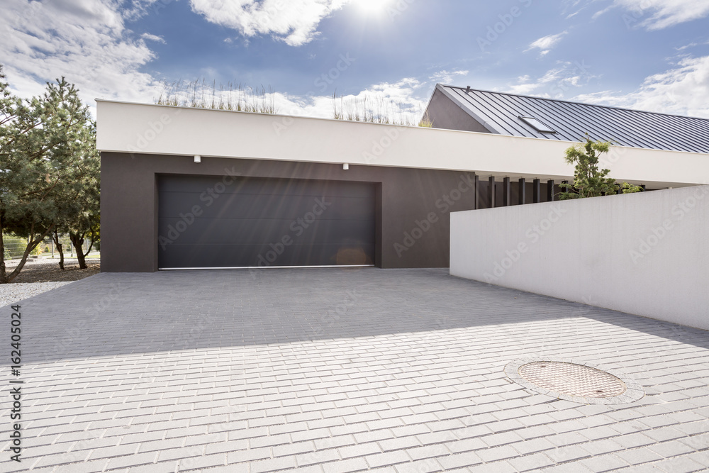 Modern garage with big driveway Stock Photo | Adobe Stock