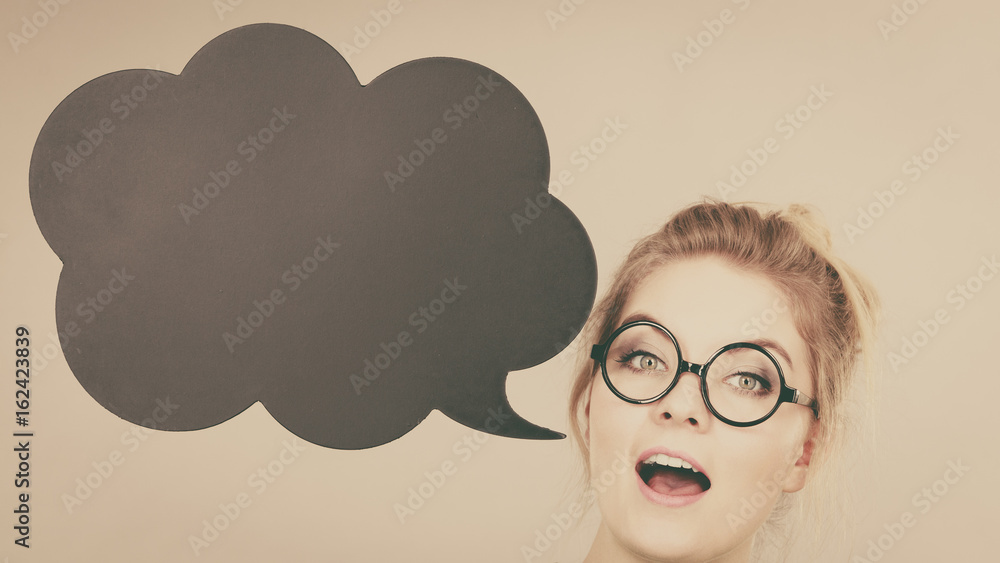 Woman holding black thinking bubble Stock Photo | Adobe Stock
