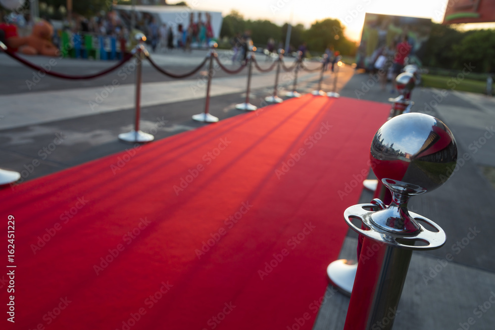 Long red carpet between rope barriers on VIP entrance. Stock Photo ...