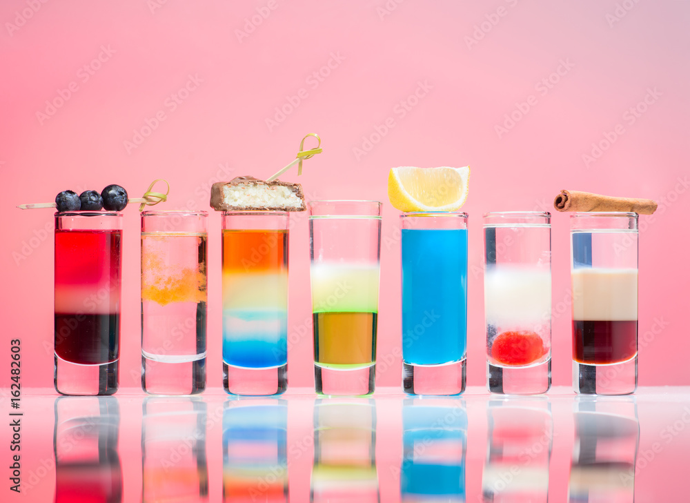 row line of different alcohol cocktails Stock Photo | Adobe Stock