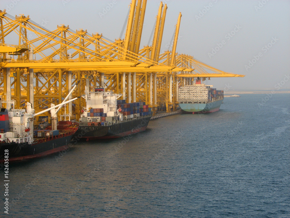 Container ship in port at container terminal. Ships of container ships ...