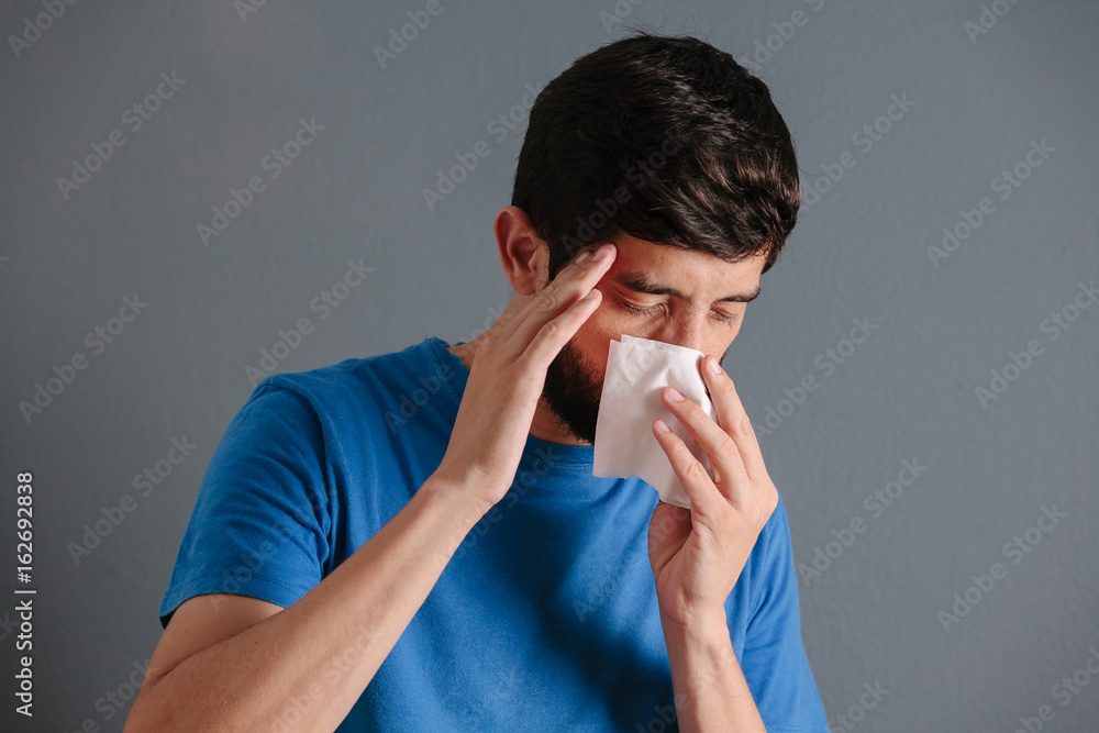 Sinus pain, sinus pressure, sinusitis. Sad man holding his nose because ...