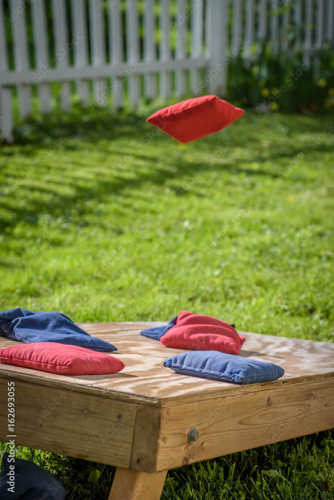 cornhole bag flying in air Stock Photo | Adobe Stock