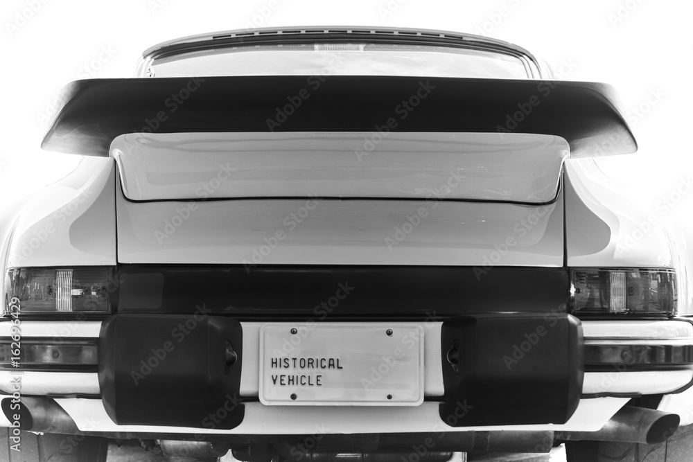 Rear of wide body of retired antique German racing car with black ...