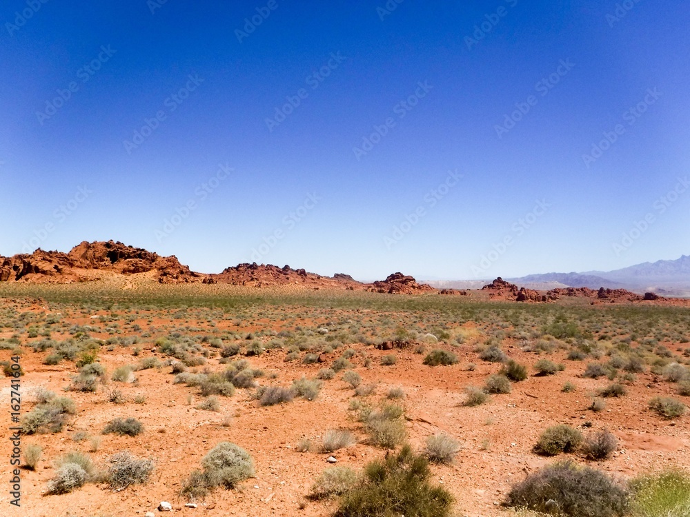 Desert floor mountain range in distance open space Valley of Fire ...