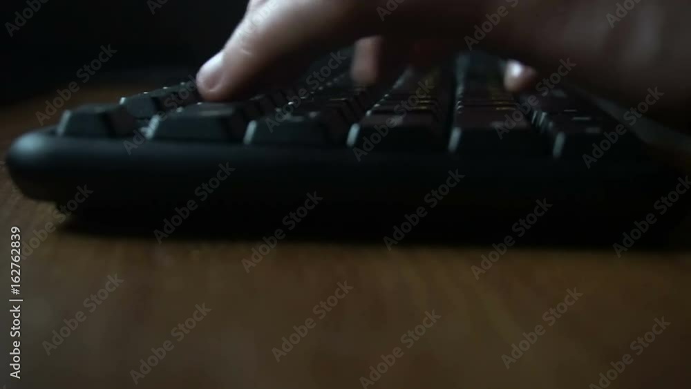 human hands working on the keyboard,dark room. Stock Video | Adobe Stock