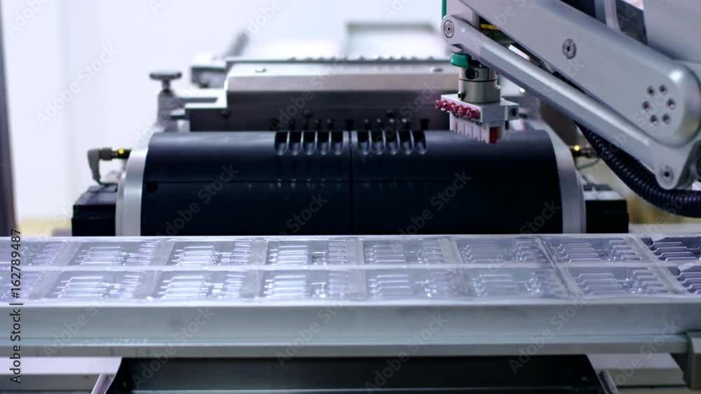 Factory worker setting pharmaceutical equipment. Engineer set medical ...