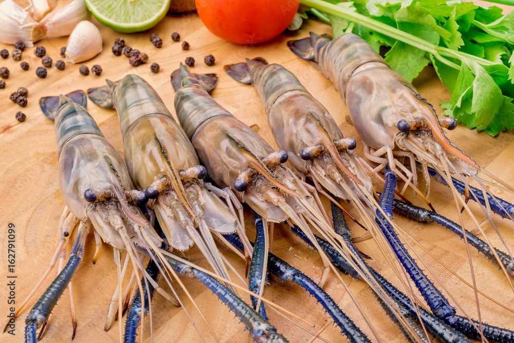 Giant tiger prawn with tomatoes, key lime, chilies, lemongrass, and ...
