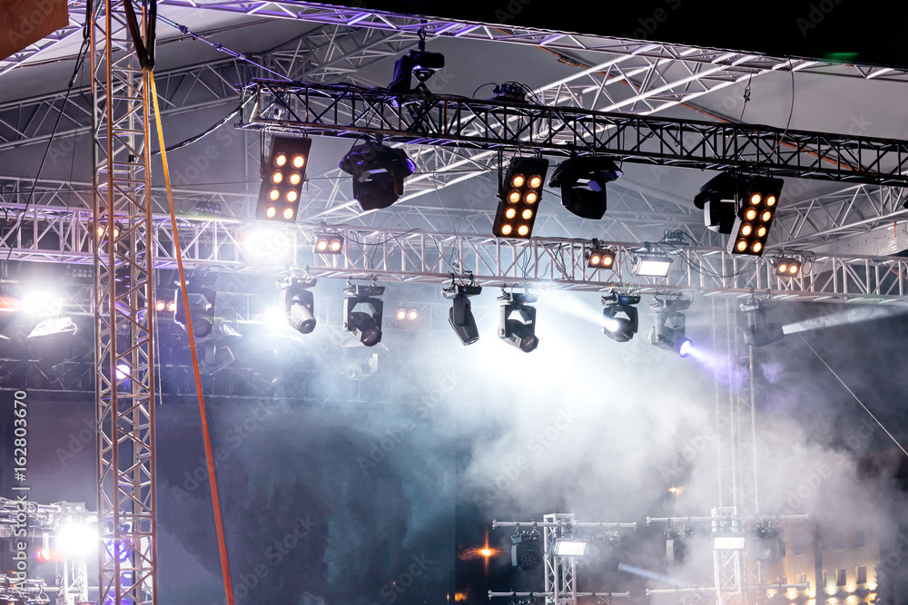 stage lights at concert. illuminated stage with scenic lights and smoke ...