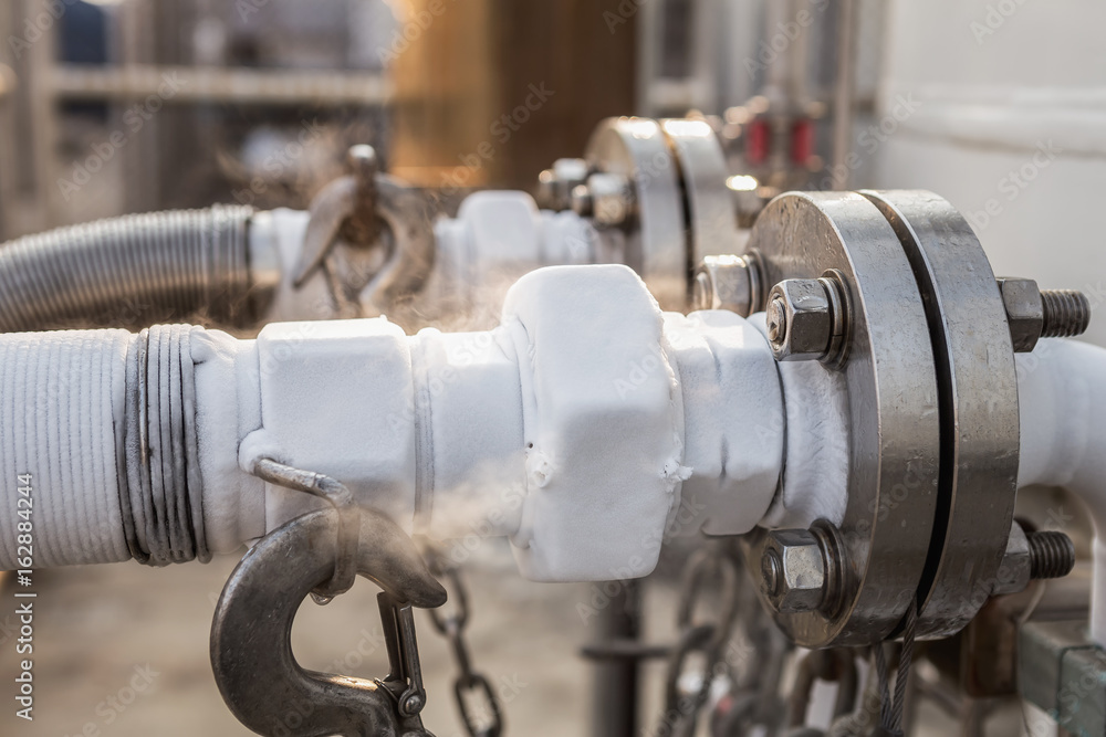 loading liquid co2 from Trailer Transport to storage tanker. Stock ...