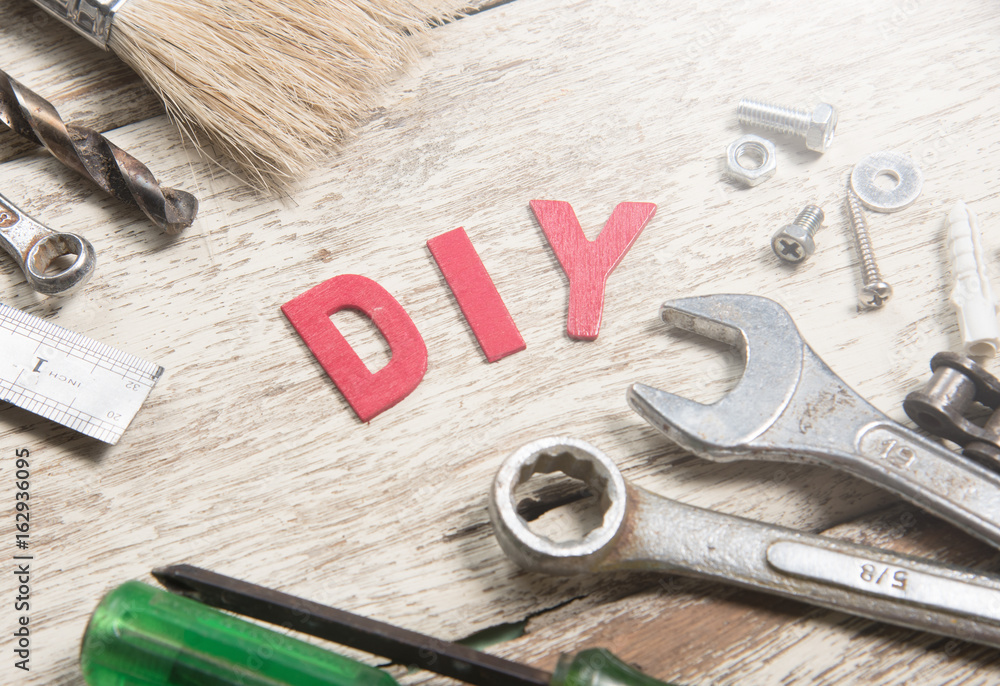 DIY,DO IT YOURSELF word made from wooden letters with set of tools on ...