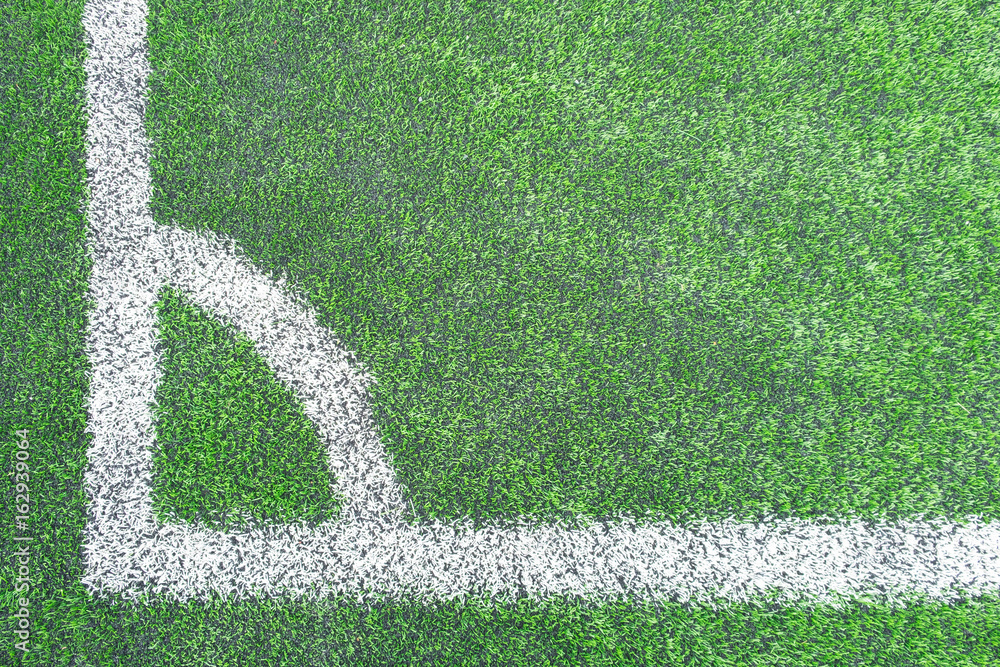 White corner line on the green football/soccer field from top view for ...