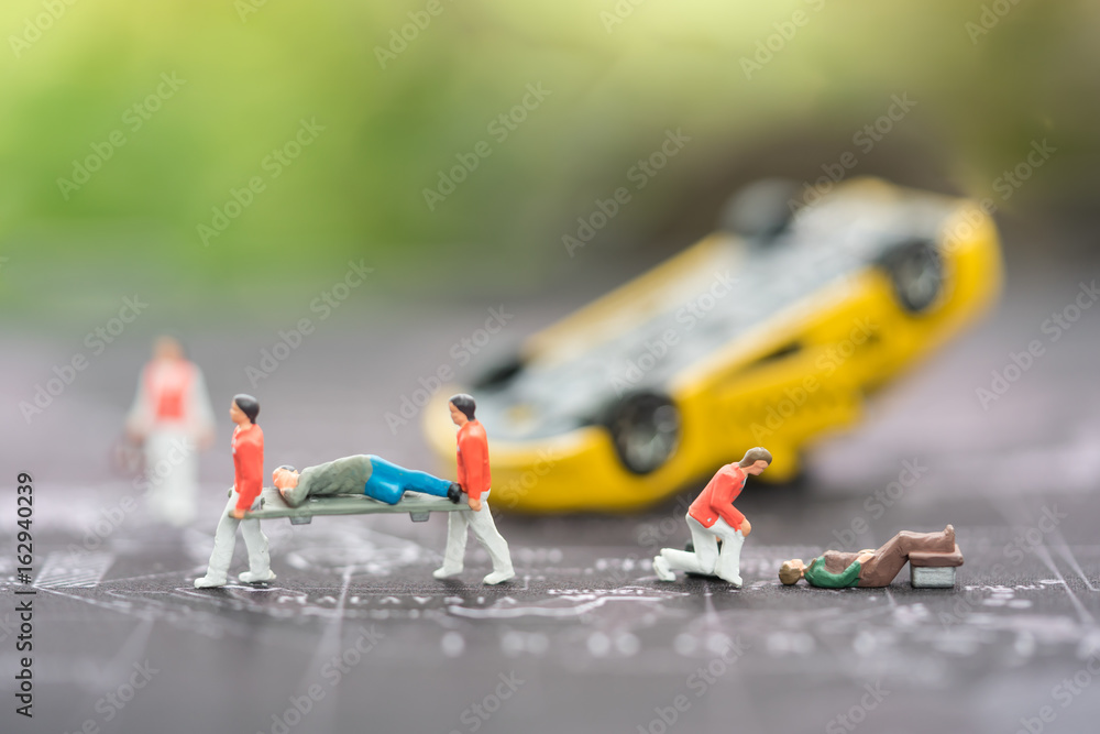 Miniature people, emergency medical team at work at accident scene, car ...