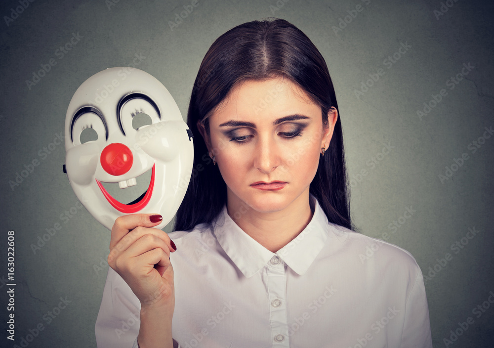 sad woman taking off clown mask expressing happiness Stock-Foto | Adobe ...