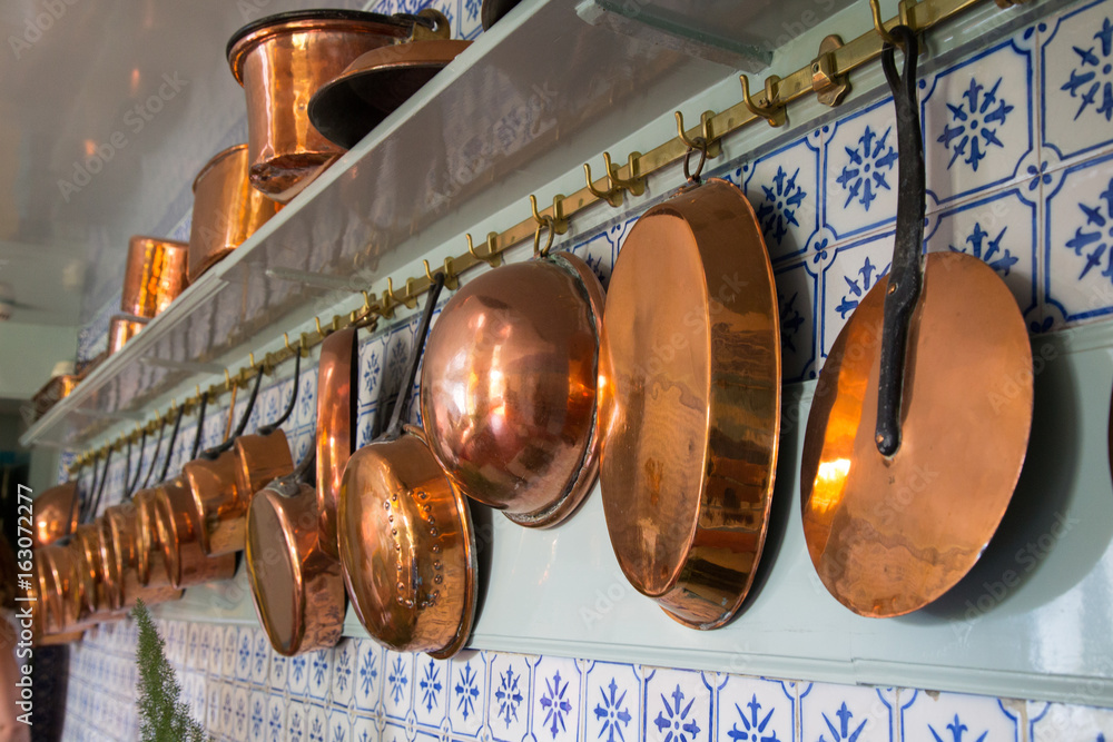 Frying pans in the blue kitchen in the Claude Monet's house, Giverny ...