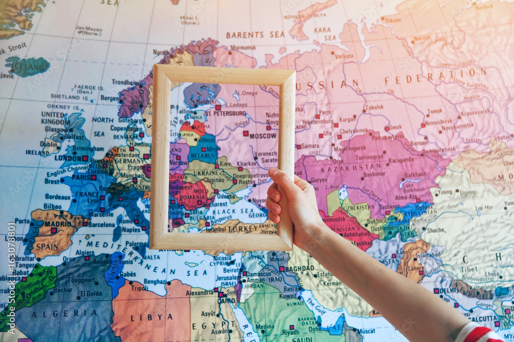hand holding empty wooden frame on Europe map background Stock Photo ...