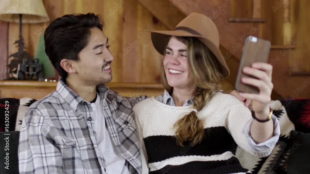 Cute Couple Pose For A Kissing Selfie" They Look At Photo And Laugh ...