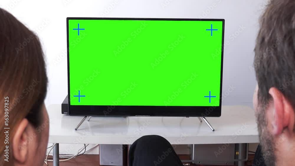 Couple Watching Television At Home Zoom In Green Screen. Couple ...