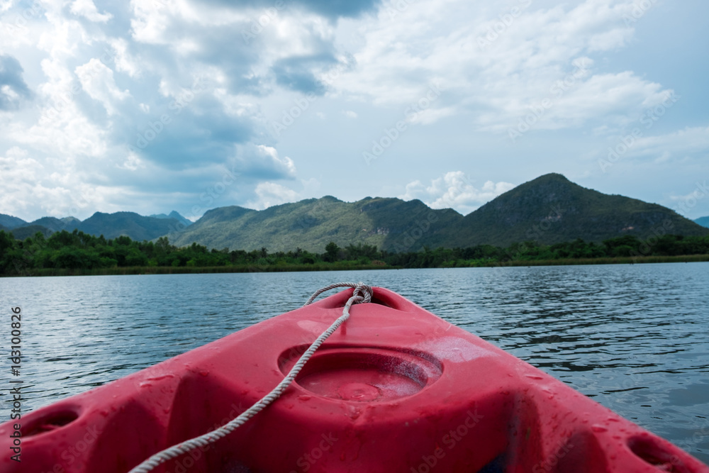 front boat view. canoe boat floating alone isolated on sea. sky ...