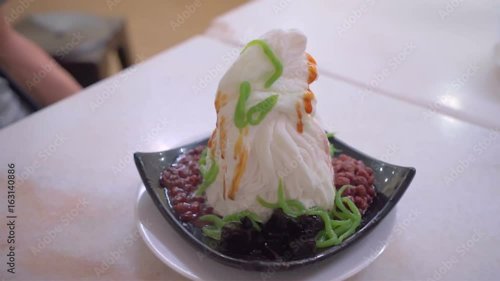 Traditional Singapore called Chendol cold dessert served with coconut ...