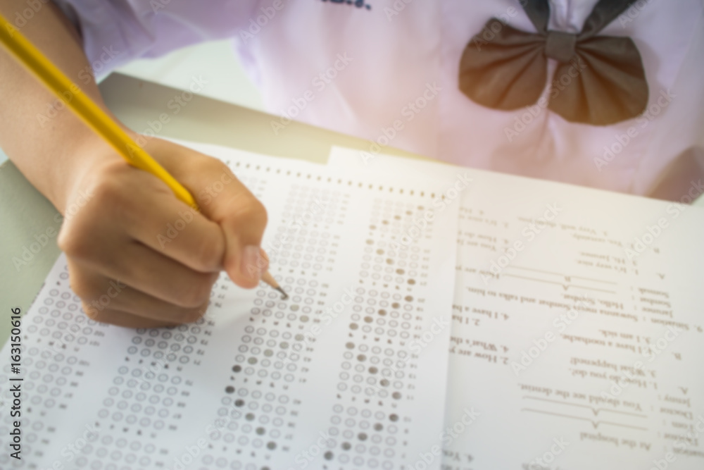 Blurred of Asian student testing english exam or exercise on exams ...