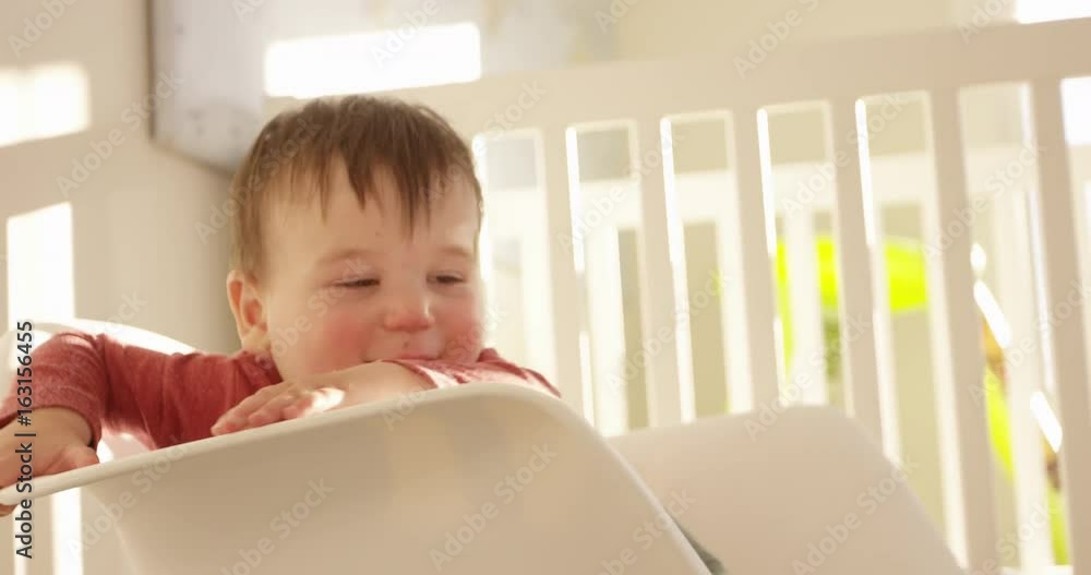 mischievous toddler plays on rocking chair Stock Video | Adobe Stock