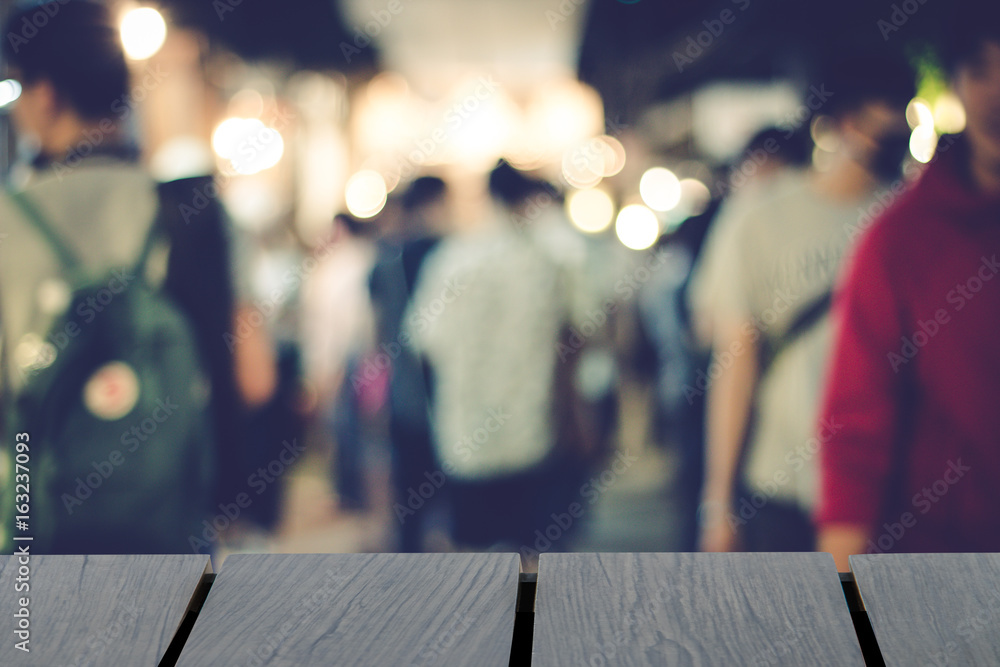 Blurred people walking background and wooden table on font. mock up ...