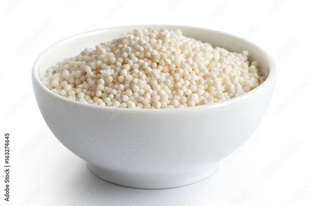 Dry tapioca pearls in white ceramic dish isolated on white. Stock Photo ...
