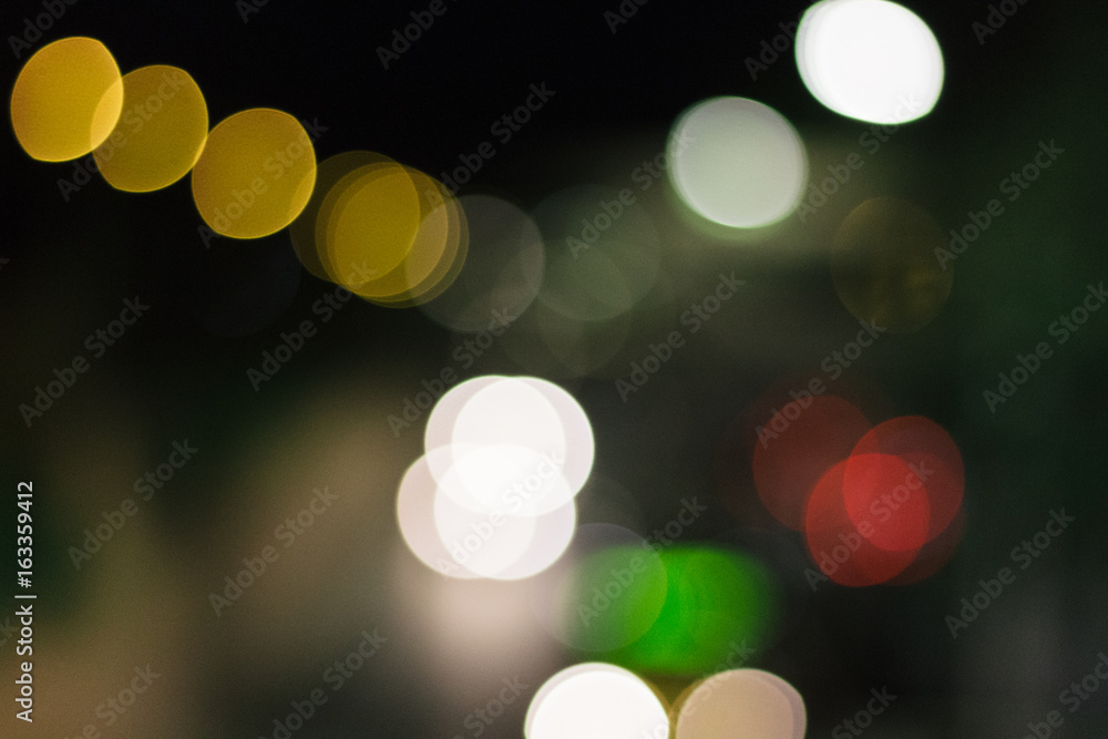Defocused night traffic lights. Bokeh lights, light transition, lens ...