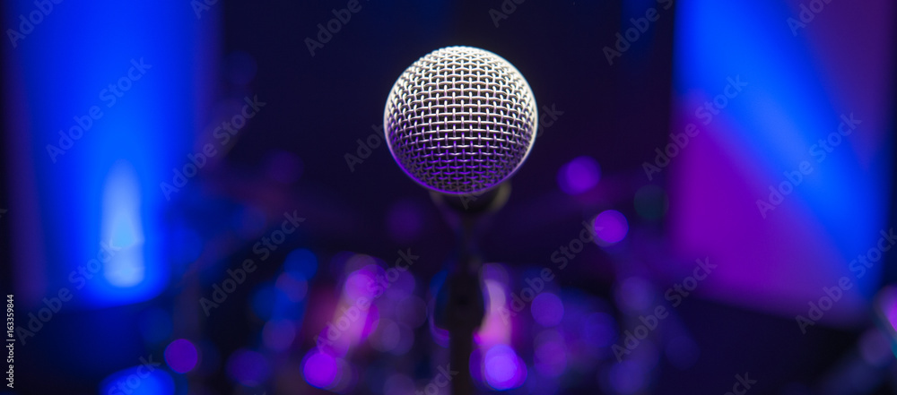 Microphone on stage against a background of auditorium Stock Photo ...