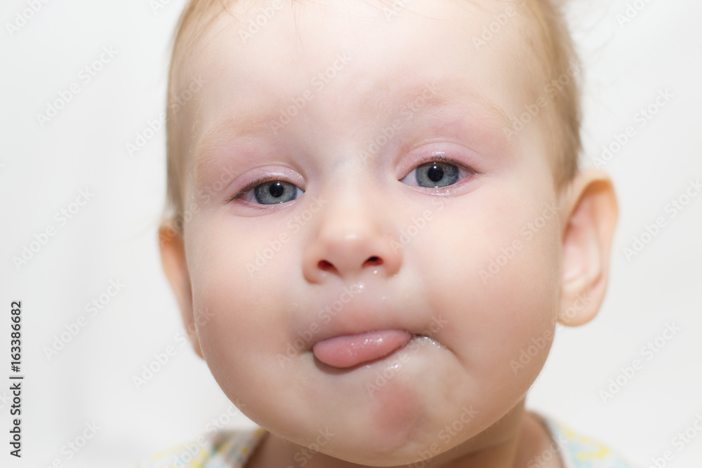 Sweet little girl with tears on her cheeks and red eyes stuck her ...