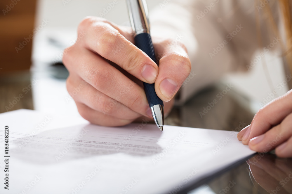 Business Person Signing Document With Pen Stock Photo | Adobe Stock