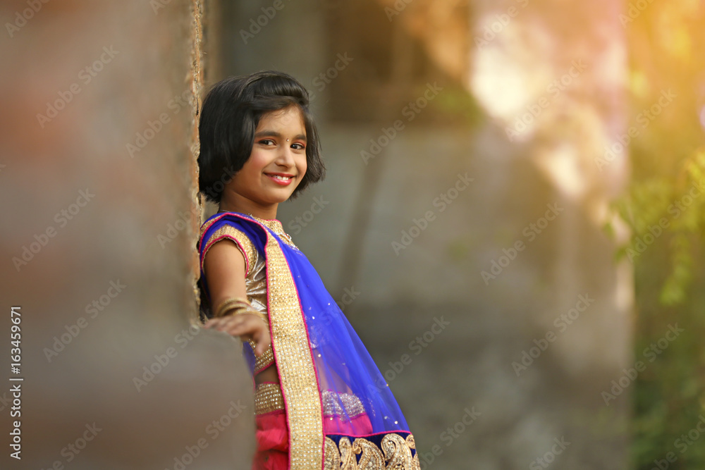 Little Indian girl in traditional sari Stock Photo | Adobe Stock
