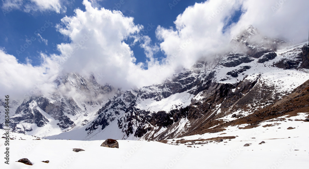 Beautiful panoramic view of the Himalayas wrapped in clouds on the way ...