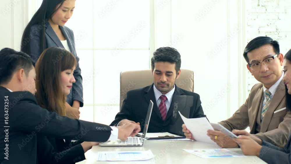 Team smart multi ethnic used document in planning for meeting and ...