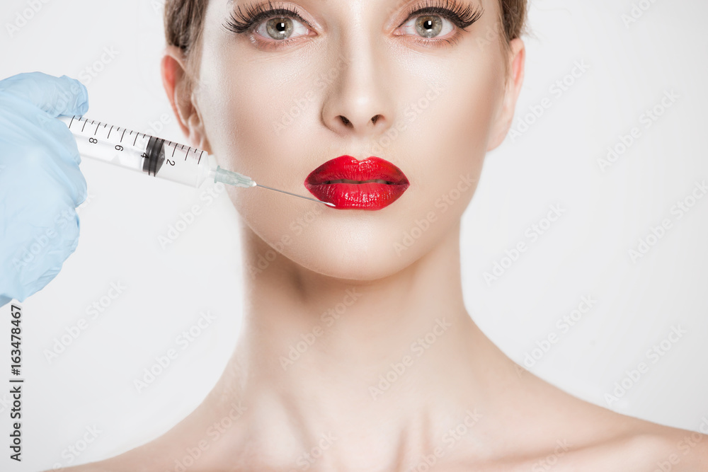 Young beautiful woman getting ready for lips augmentation, plastic ...