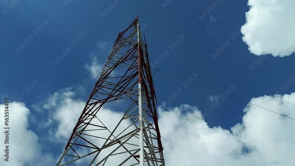 a timelapse or hyperlapse of 3 erectors or riggers working at height ...