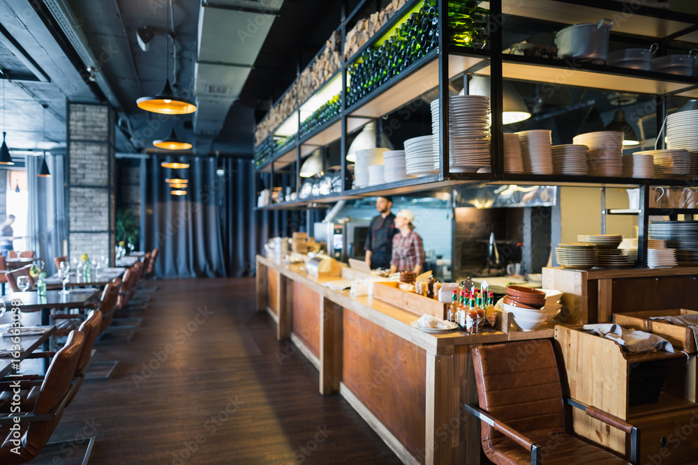Restaurant kitchen interior: bar counter made of natural stone, fences ...