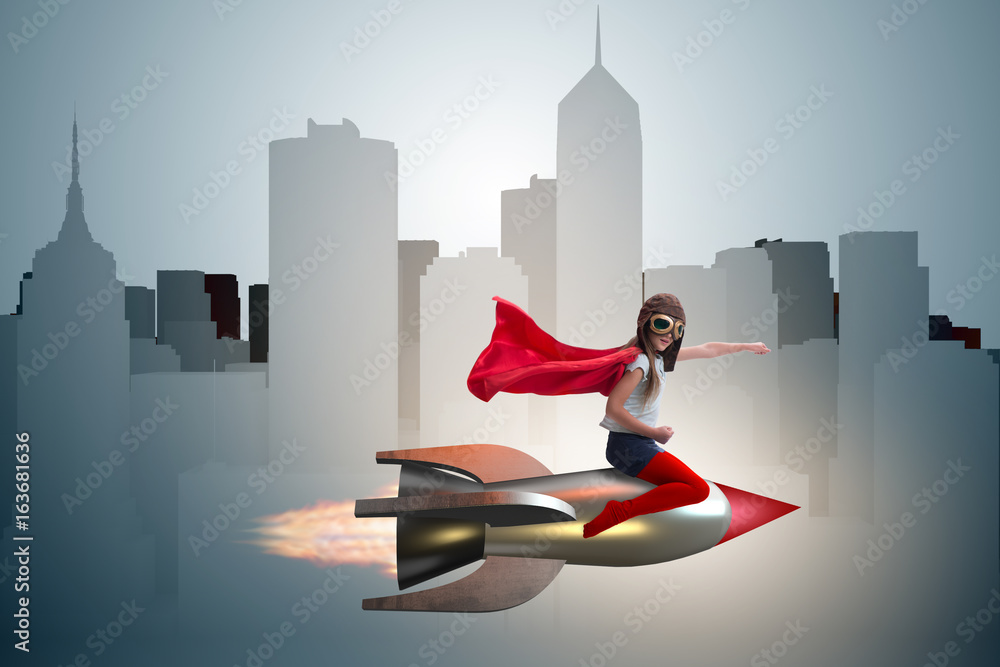 Little girl flying rocket in superhero concept Stock Photo | Adobe Stock