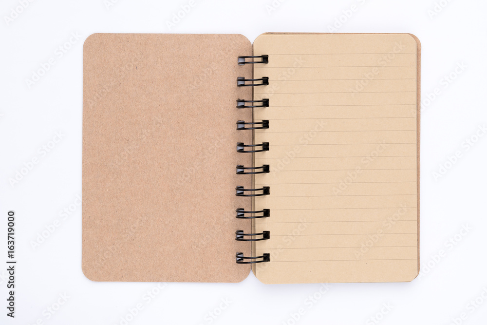 Top view of opening brown lined pages spiral notebook on the white ...