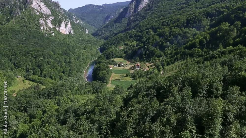 Tara canyon Tara river Montenegro. Houses smoke tube. Tilting view shot ...