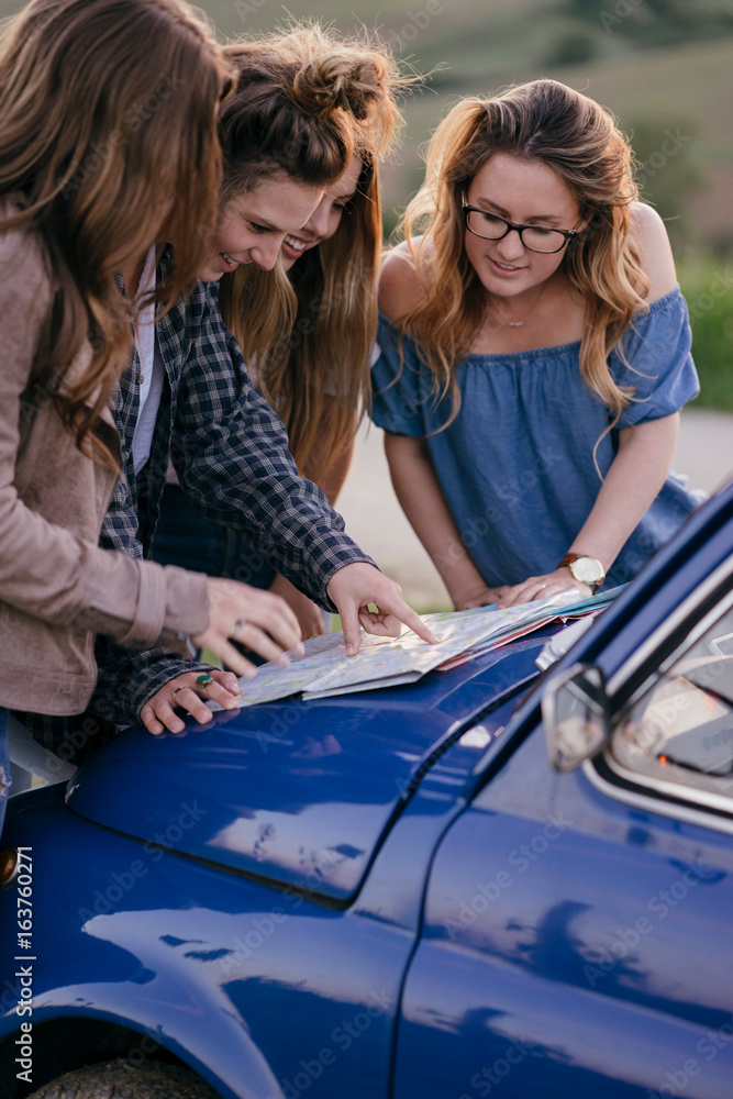 Tourists reading road map Stock Photo | Adobe Stock