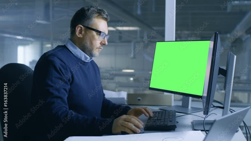 Chief Male Engineer Working on Technical Project on His Person Computer ...