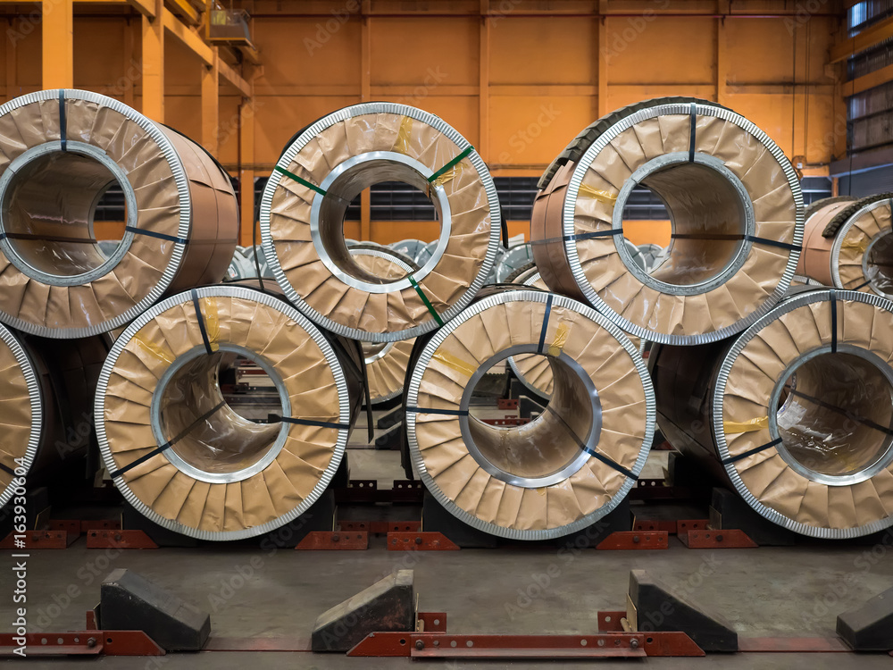 Steel coil in paper packaging are stacking in warehouse. Photos | Adobe ...
